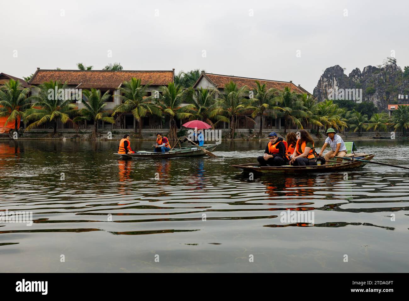 Tourist on a boat tour at Tam Coc in vietnam Stock Photo - Alamy