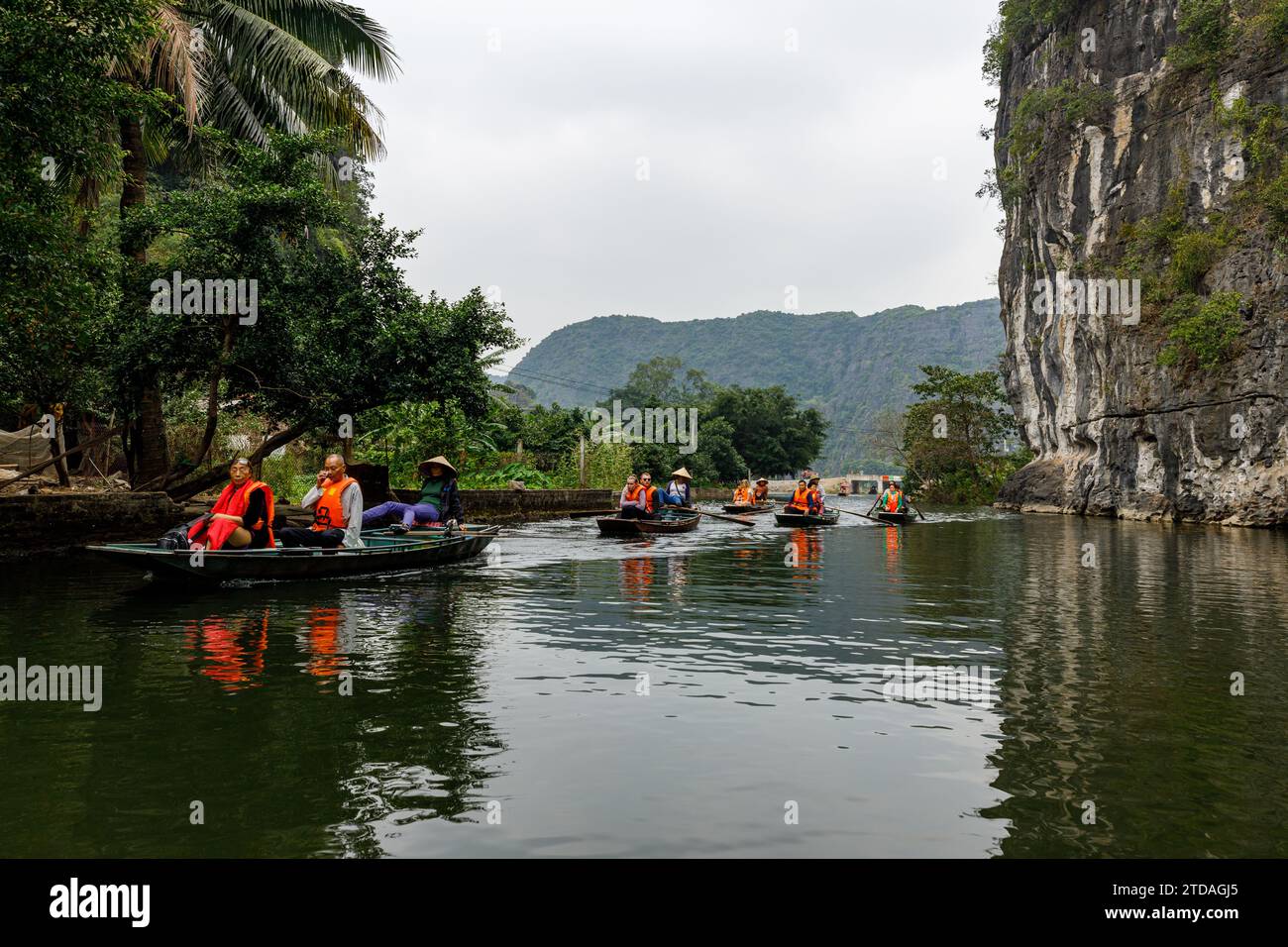 Tourist on a boat tour at Tam Coc in vietnam Stock Photo - Alamy