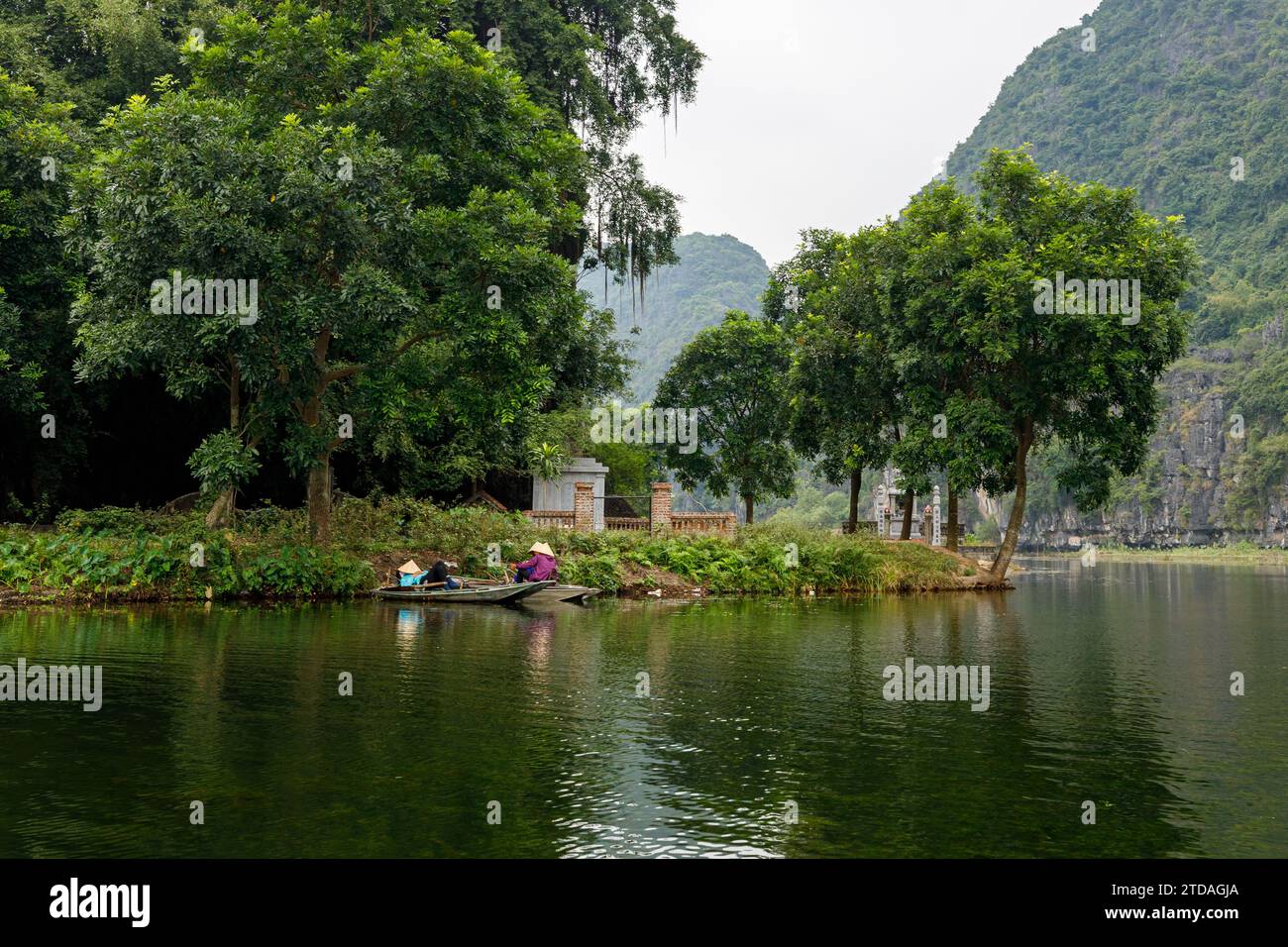 Tourist on a boat tour at Tam Coc in vietnam Stock Photo - Alamy