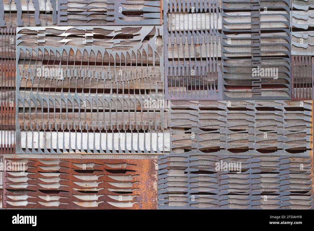 Perforated iron rusty plates with perforations in shape of various ...