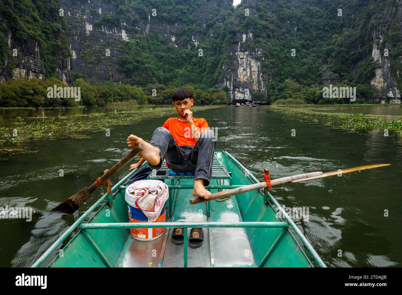 Tourist on a boat tour at Tam Coc in vietnam Stock Photo - Alamy