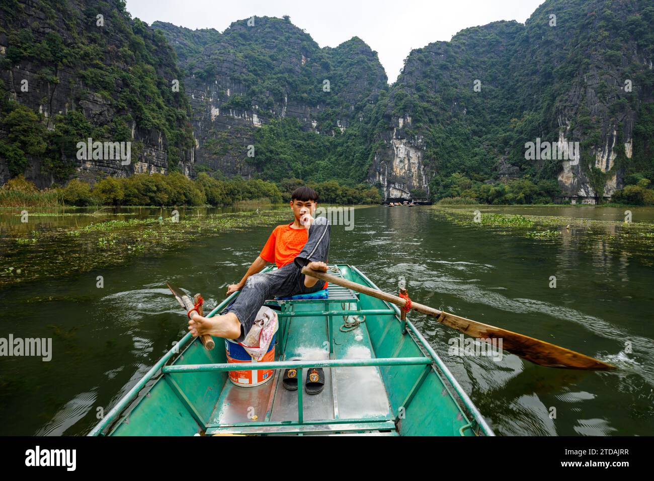 Tourist on a boat tour at Tam Coc in vietnam Stock Photo - Alamy