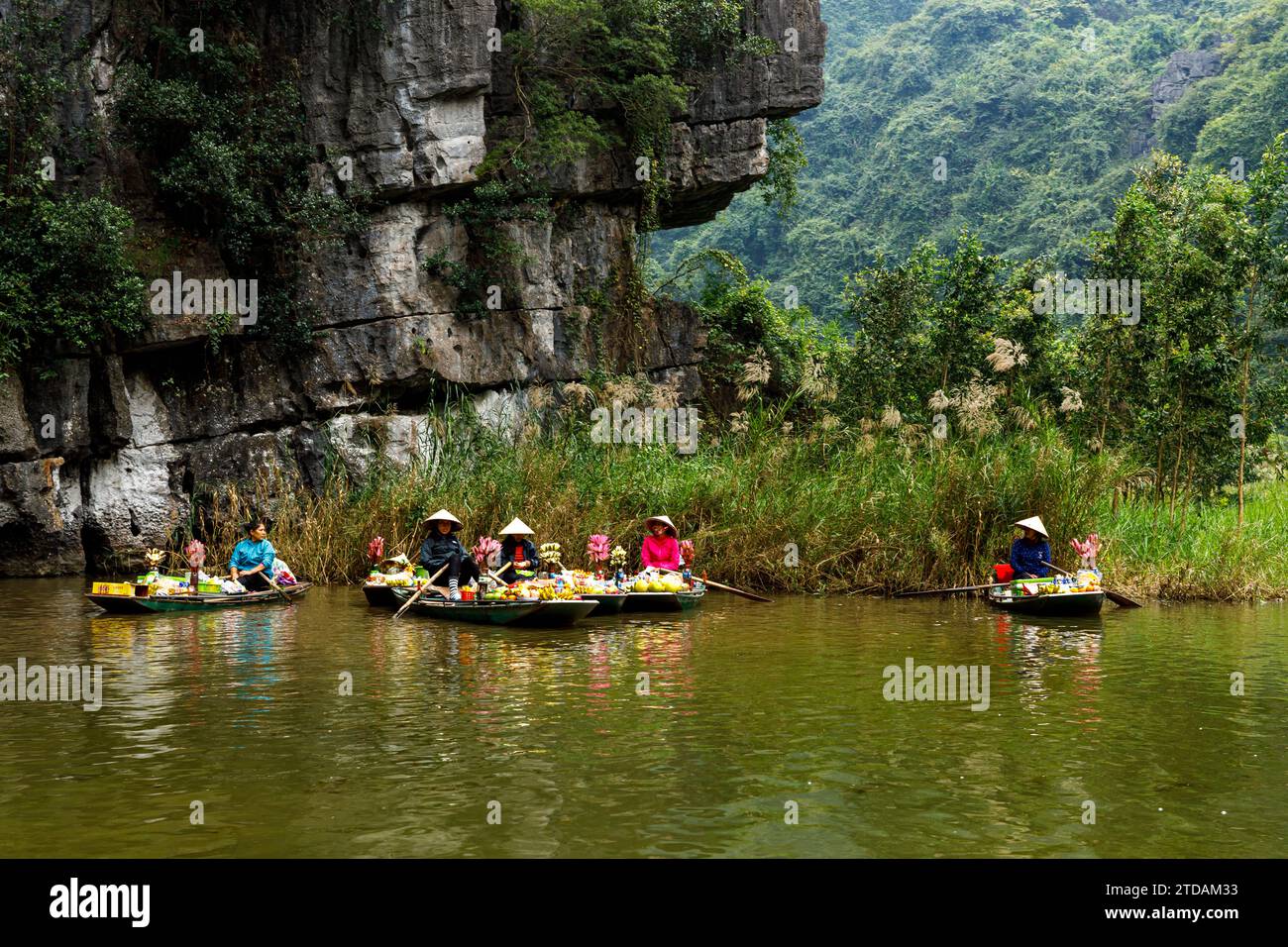 Tourist on a boat tour at Tam Coc in vietnam Stock Photo - Alamy