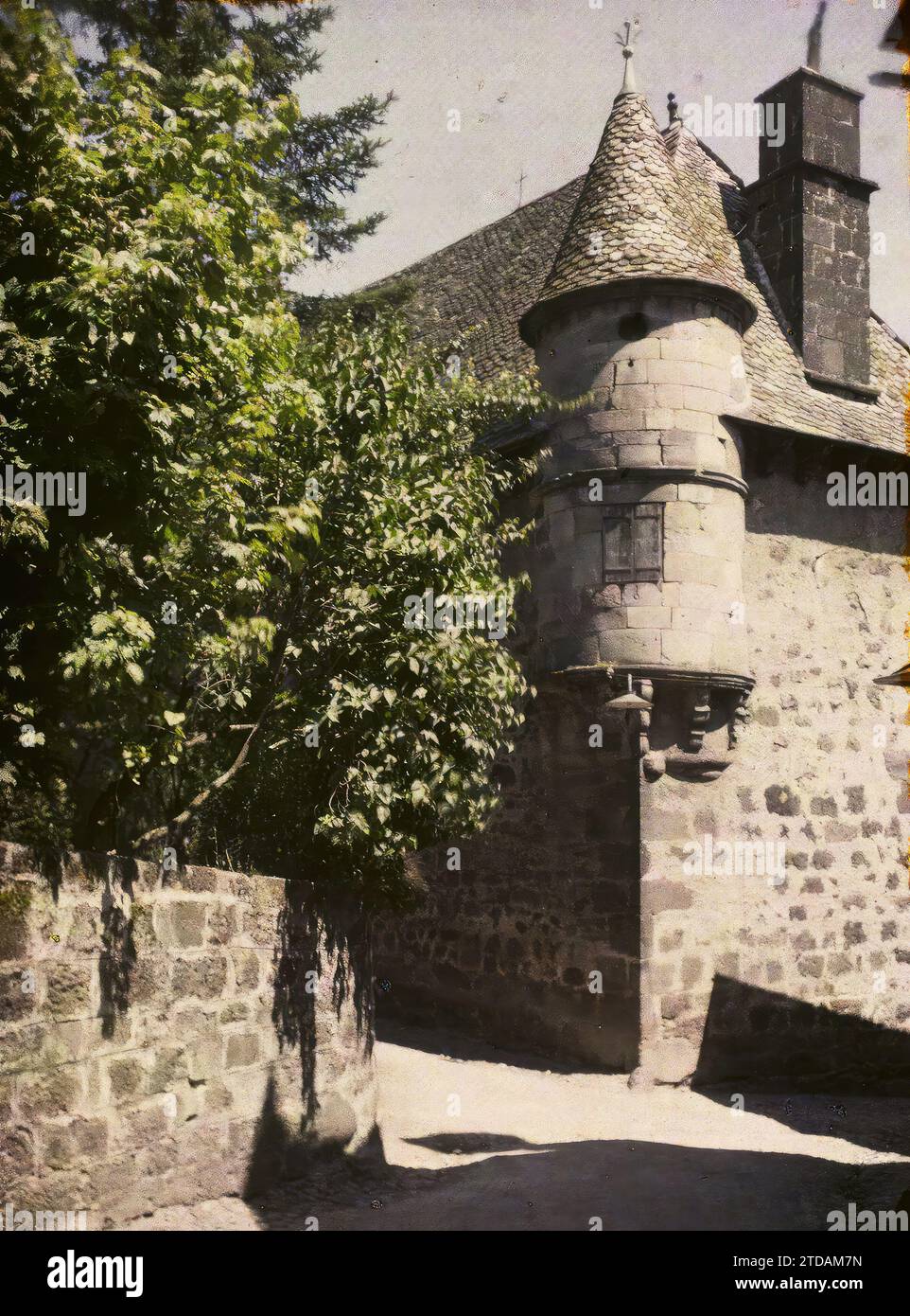 Vic-sur-Cère, France A building with a corner turret, former Château du ...