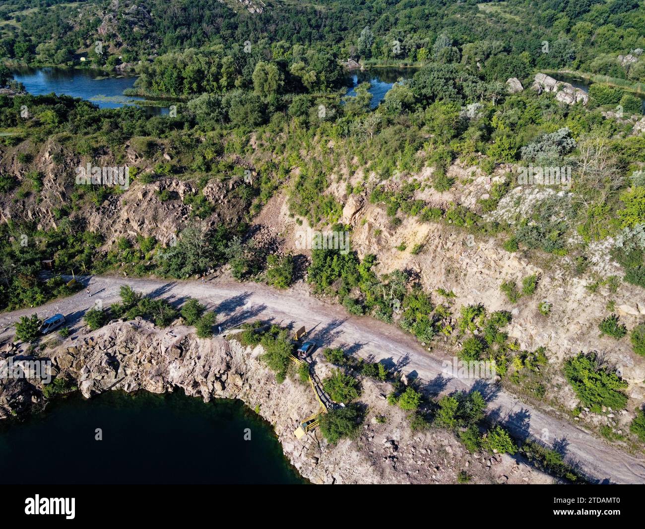 Rocky terrain overgrown with sparse vegetation, aerial view. Summer ...
