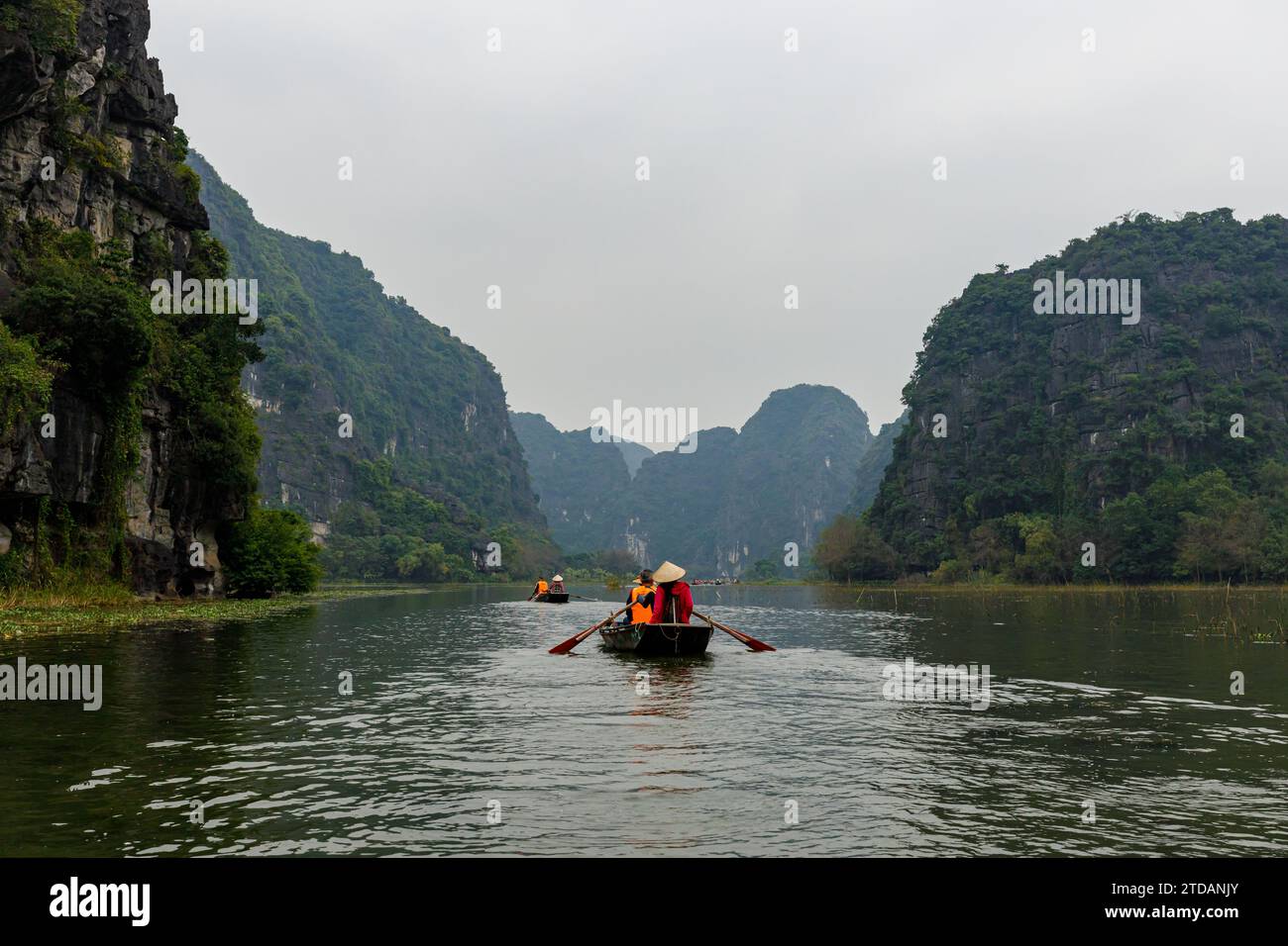 Tourist on a boat tour at Tam Coc in vietnam Stock Photo - Alamy