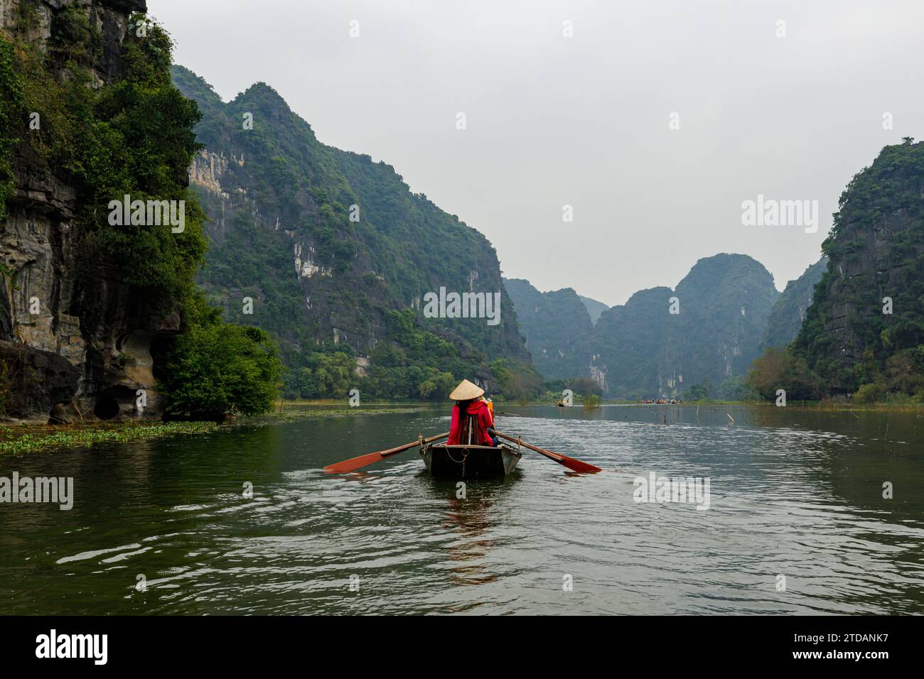 Tourist on a boat tour at Tam Coc in vietnam Stock Photo - Alamy