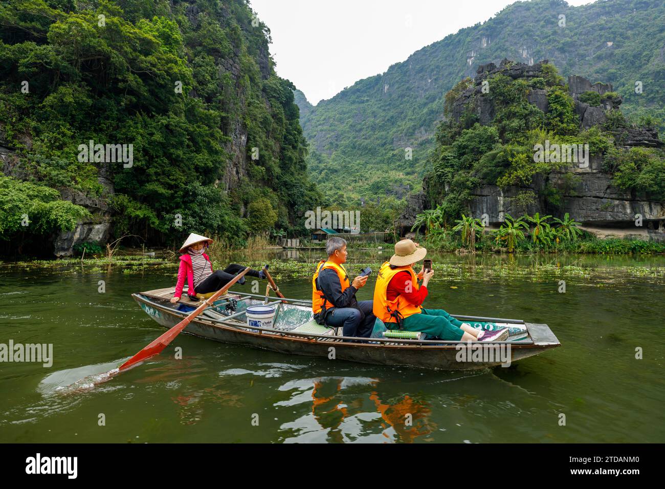 Tourist on a boat tour at Tam Coc in vietnam Stock Photo - Alamy