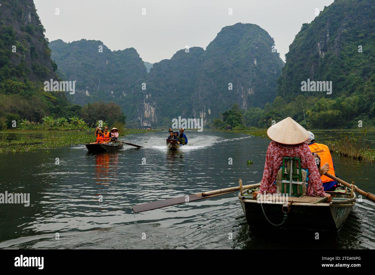 Tourist on a boat tour at Tam Coc in vietnam Stock Photo - Alamy