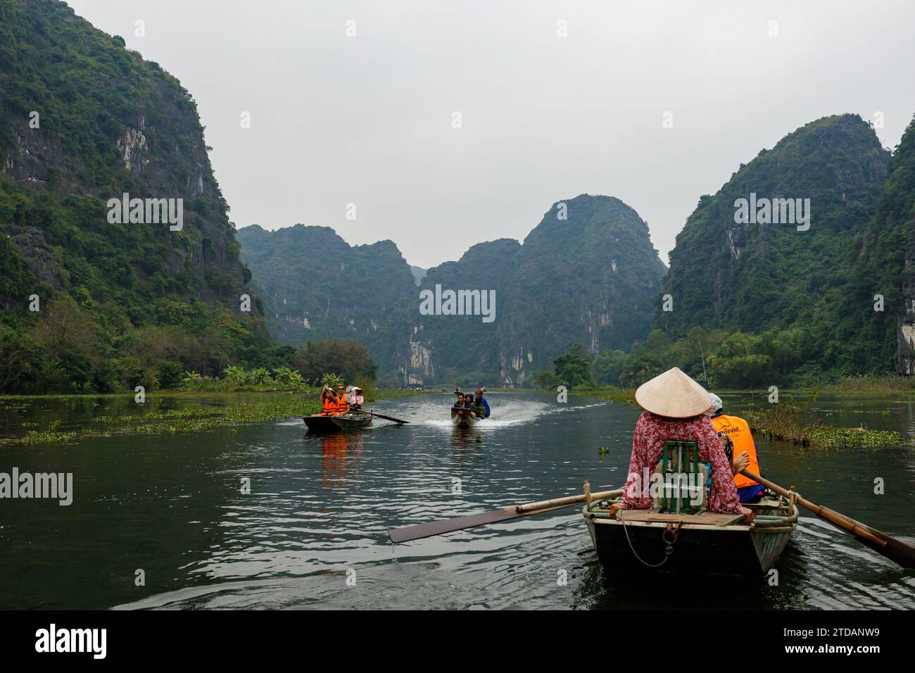 Tourist on a boat tour at Tam Coc in vietnam Stock Photo - Alamy