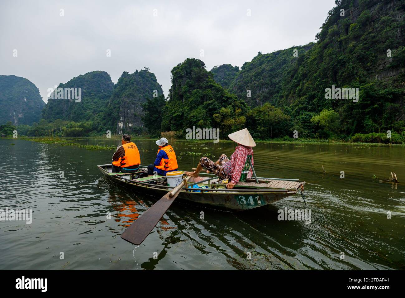 Tourist on a boat tour at Tam Coc in vietnam Stock Photo - Alamy