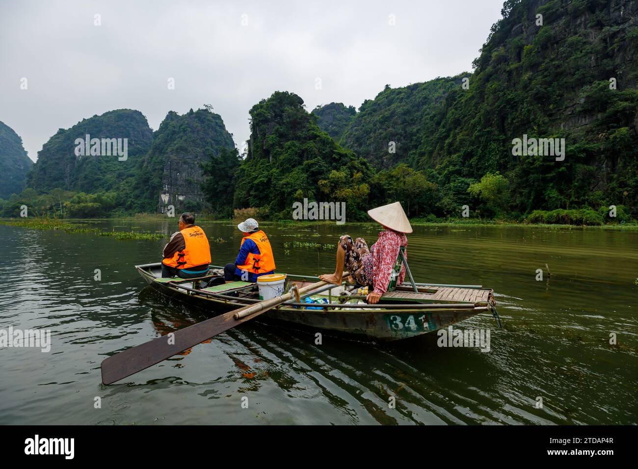 Tourist on a boat tour at Tam Coc in vietnam Stock Photo - Alamy