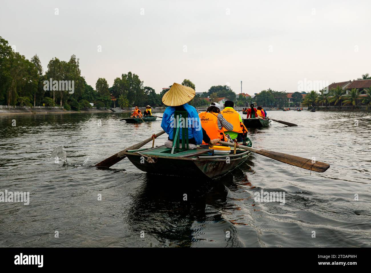 Tourist on a boat tour at Tam Coc in vietnam Stock Photo - Alamy