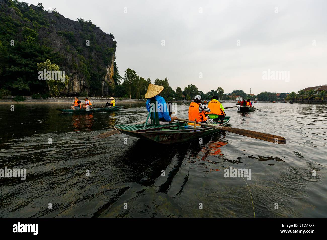 Tourist on a boat tour at Tam Coc in vietnam Stock Photo - Alamy