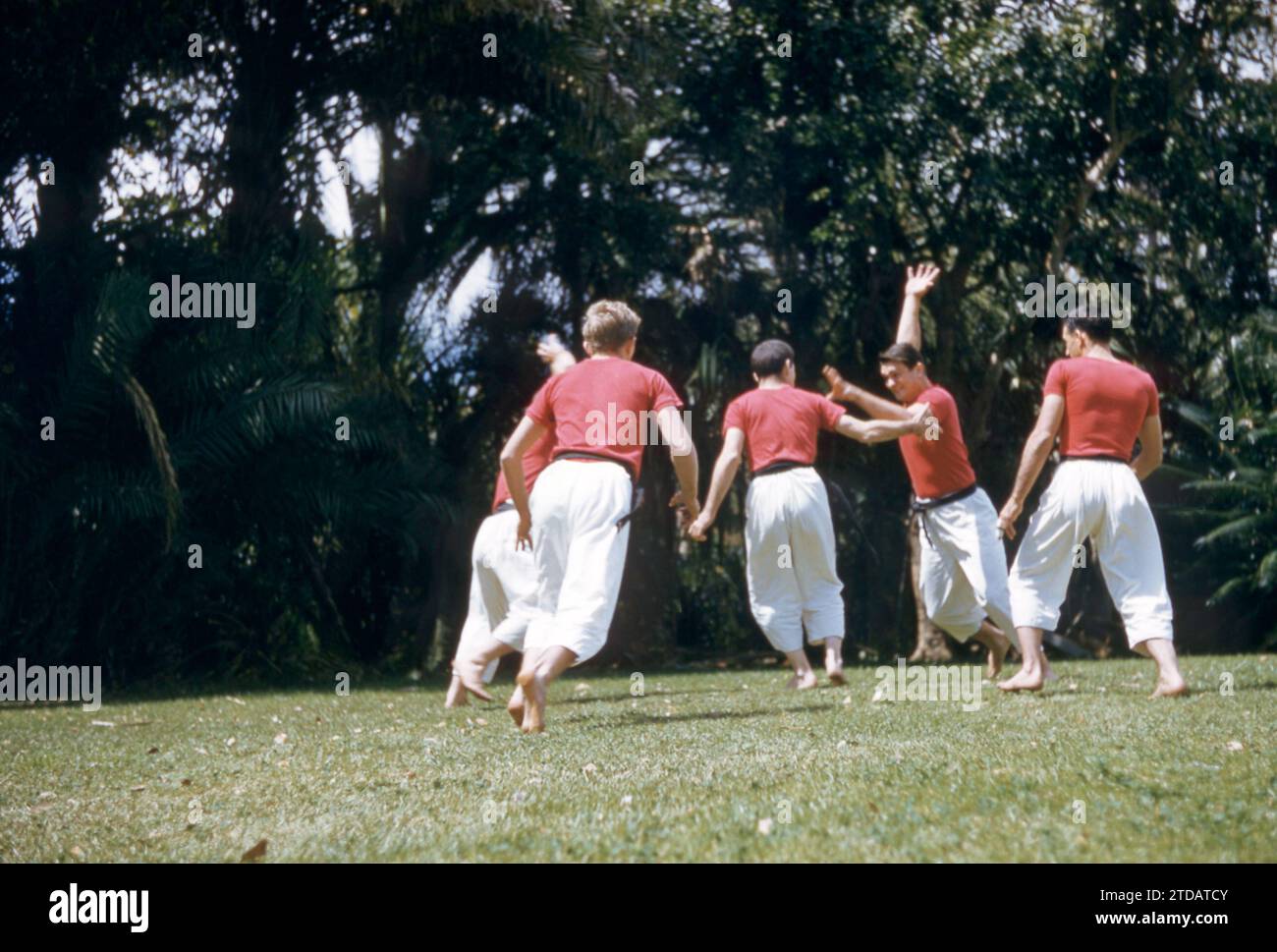 1950'S: A group of men practice karate flipping moves circa 1950's ...