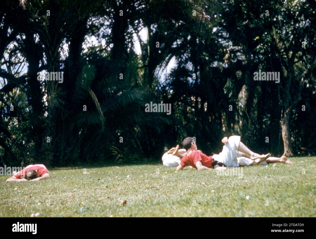 1950'S: A group of men practice karate flipping moves circa 1950's ...