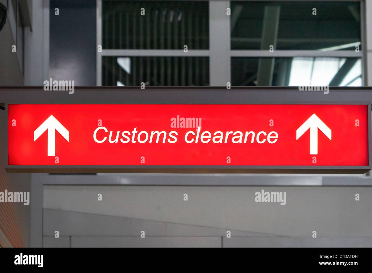 Customs sign in Airport and direction arrow, red and lighted. Travel ...