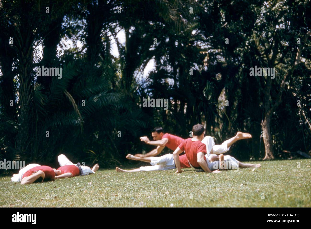 1950'S: A group of men practice karate flipping moves circa 1950's ...