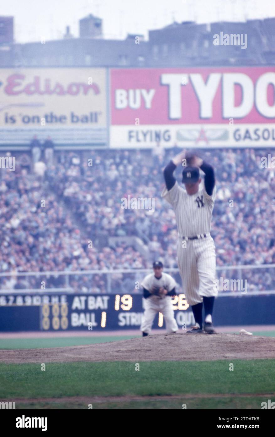 BRONX, NY - 1955: Pitcher Whitey Ford #16 of the New York Yankees goes into his wind-up during ...
