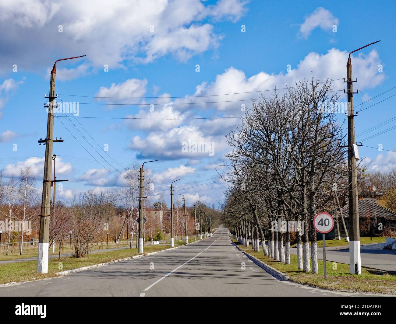A rural road with a speed limit sign Stock Photo - Alamy