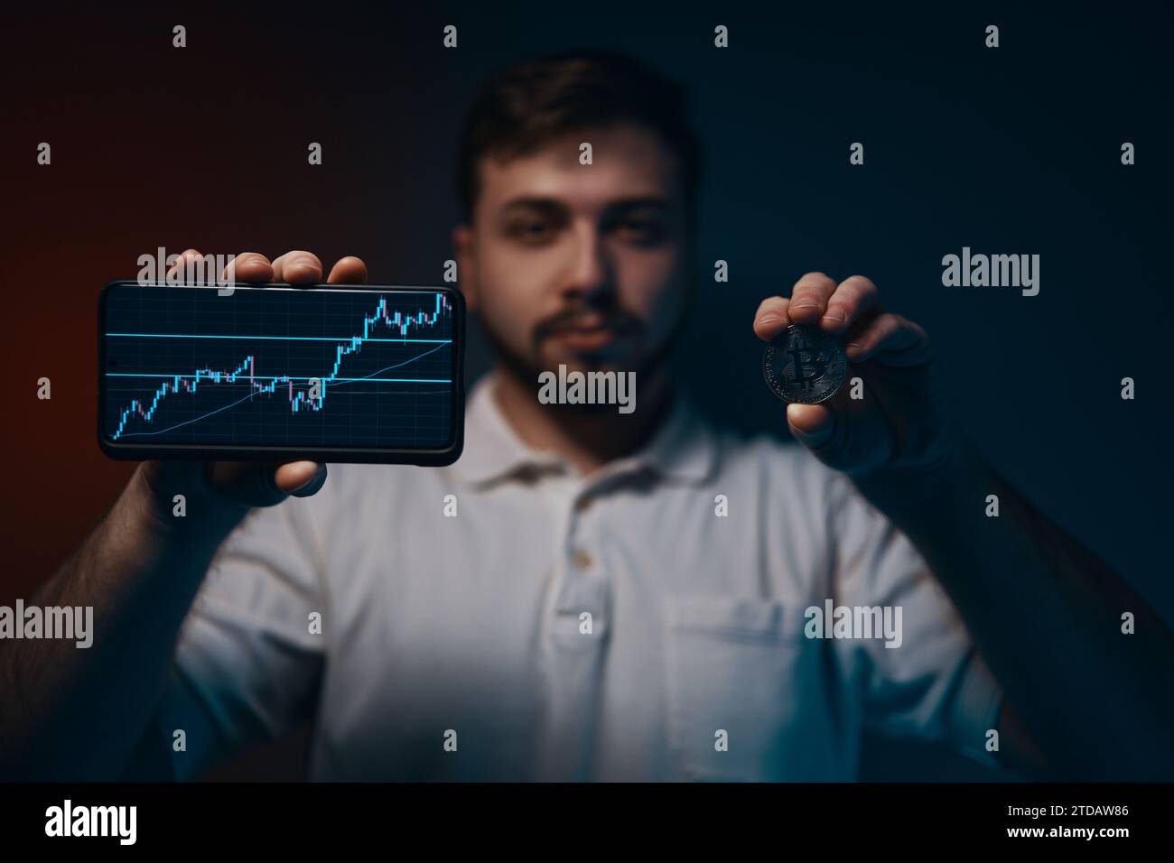 Man holding cryptocurrency graph in hands with bitcoin Stock Photo - Alamy