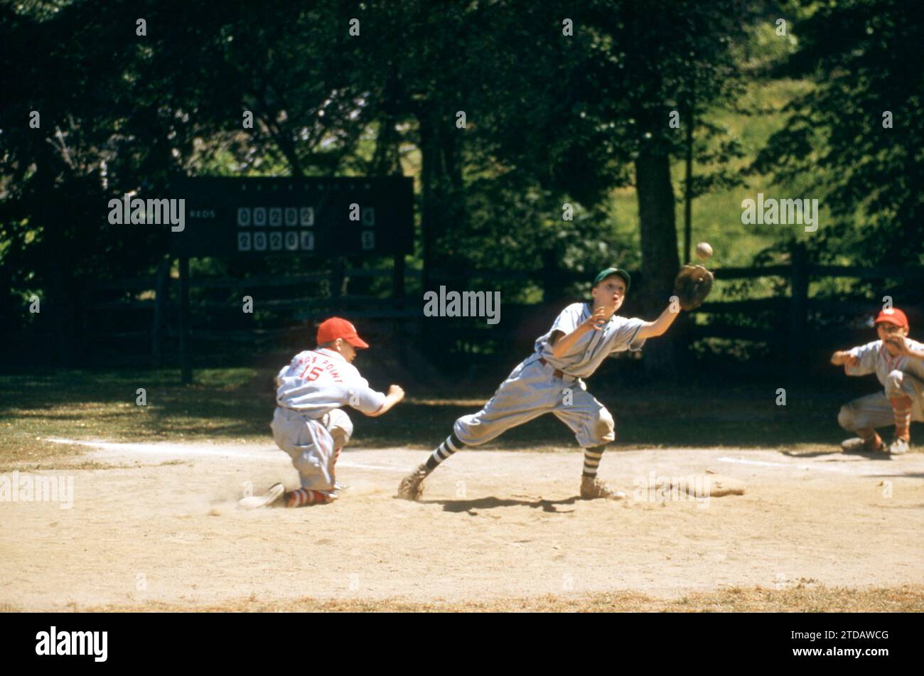 KINGS POINT, NY - 1960'S: General view of a child sliding back to the ...