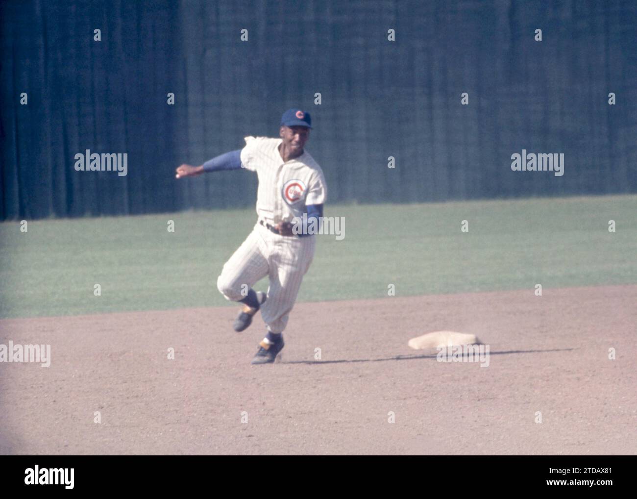 APRIL, 1962: Ernie Banks #14 of the Chicago Cubs runs around second ...