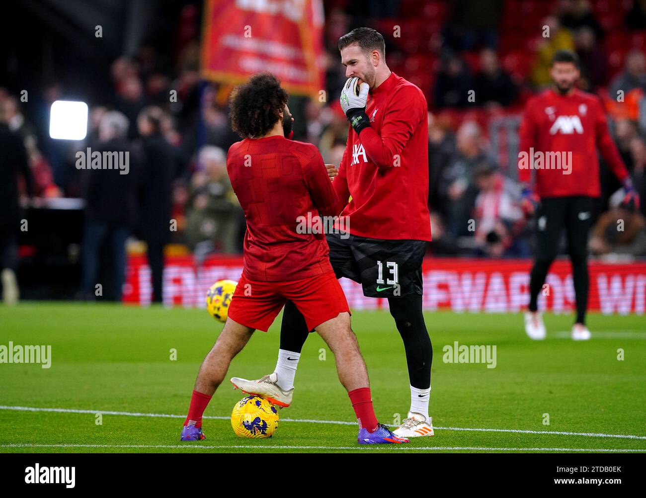 Liverpool's Mohamed Salah (left) speaks to goalkeeper Adrian during the ...