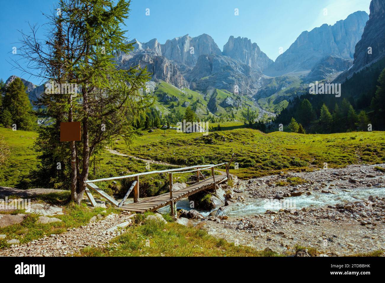 Summer time in Dolomites. landscape with mountains, river, trees and ...