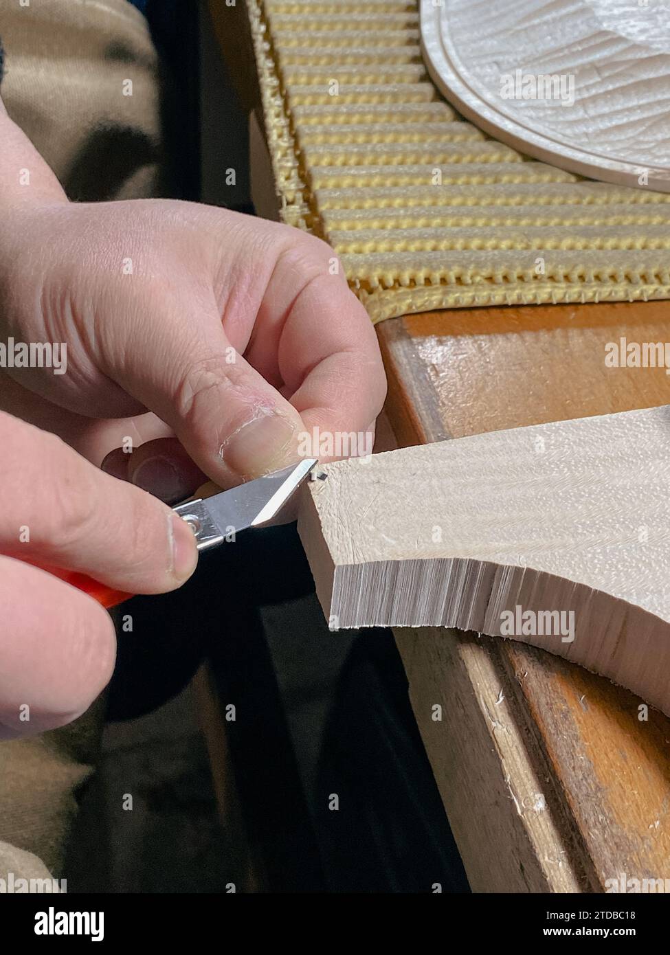 violin maker artisan cutting fillet purfling with tool to join other ...