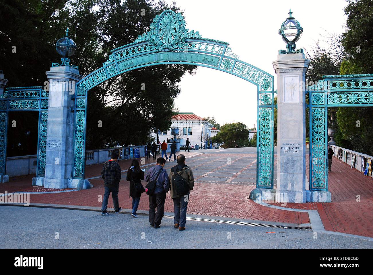 Students and visitors walk through the historic Sather gates to the ...