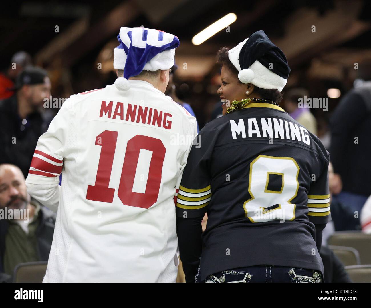 New Orleans, USA. 17th Dec, 2023. A couple show support for both former ...