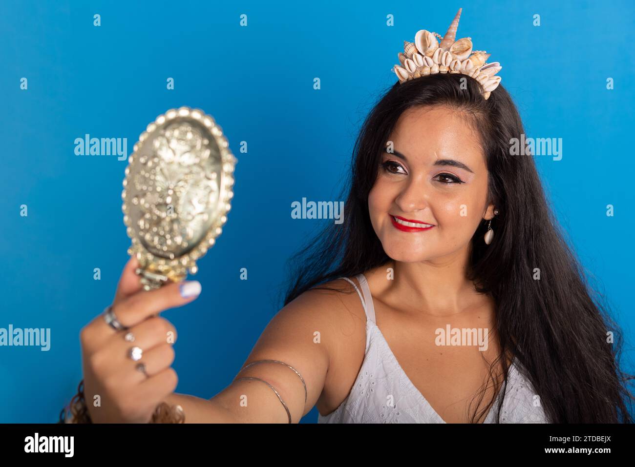 Portrait of beautiful black-haired woman wearing white clothing ...