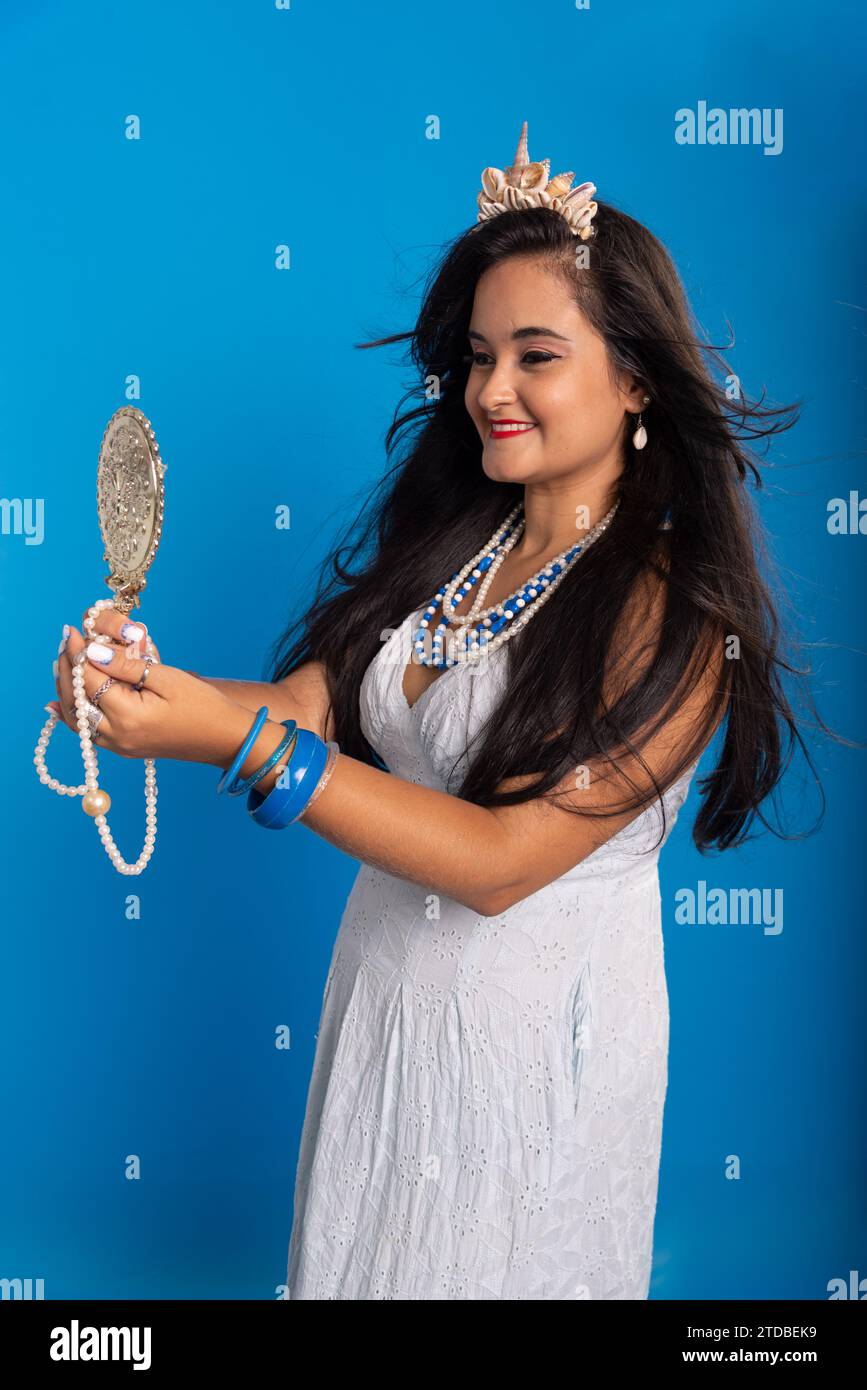 Portrait of beautiful black-haired woman wearing white clothing ...