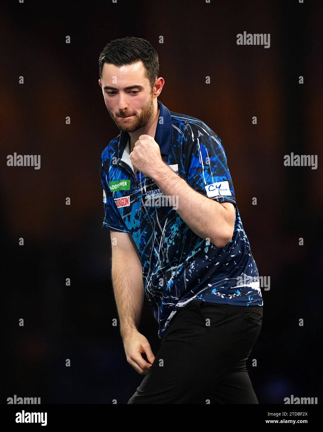 Luke Humphries celebrates victory over Lee Evans (not pictured) on day ...