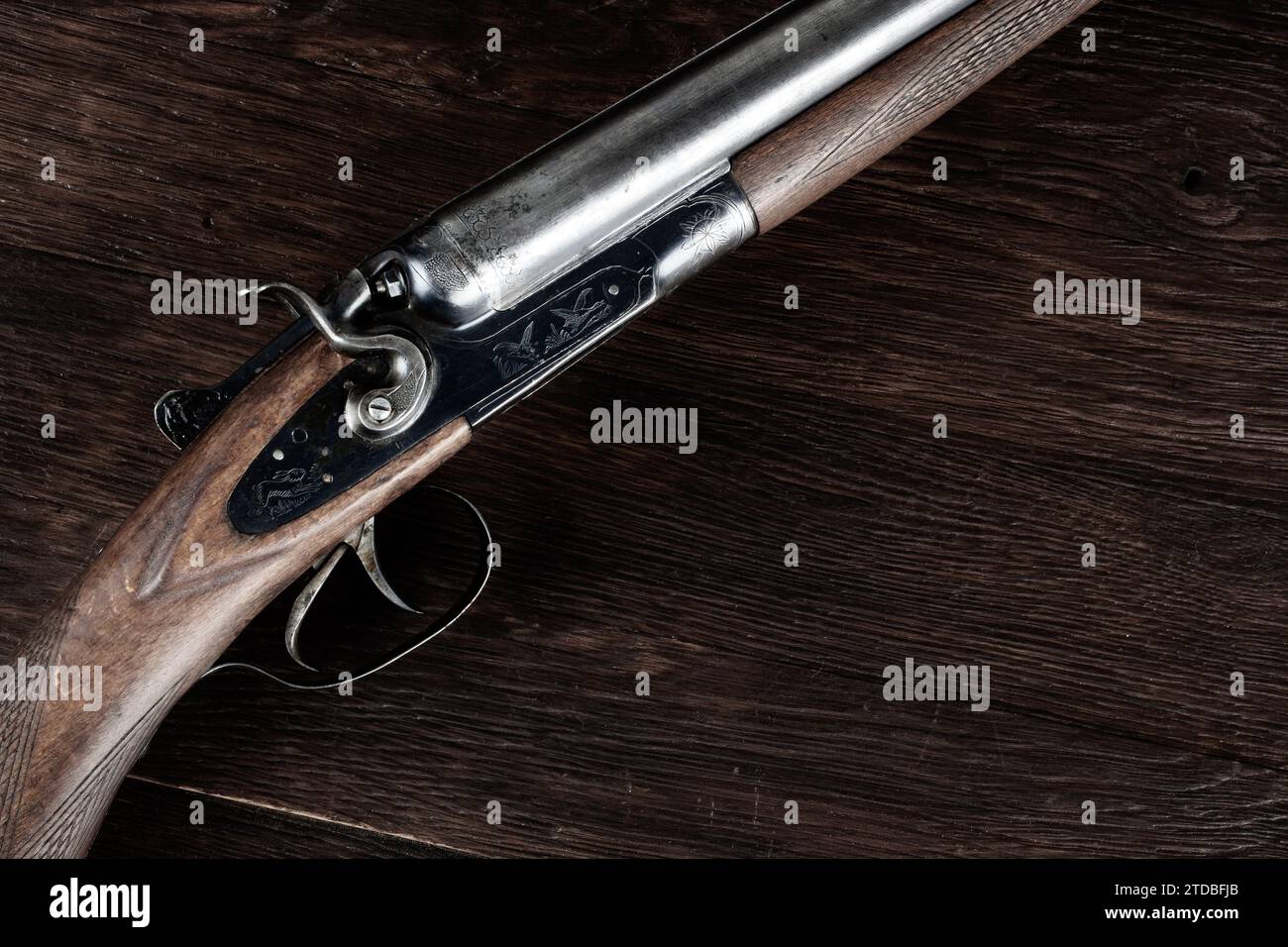 Antique 12 gauge break action smooth bored shotgun on wooden table ...