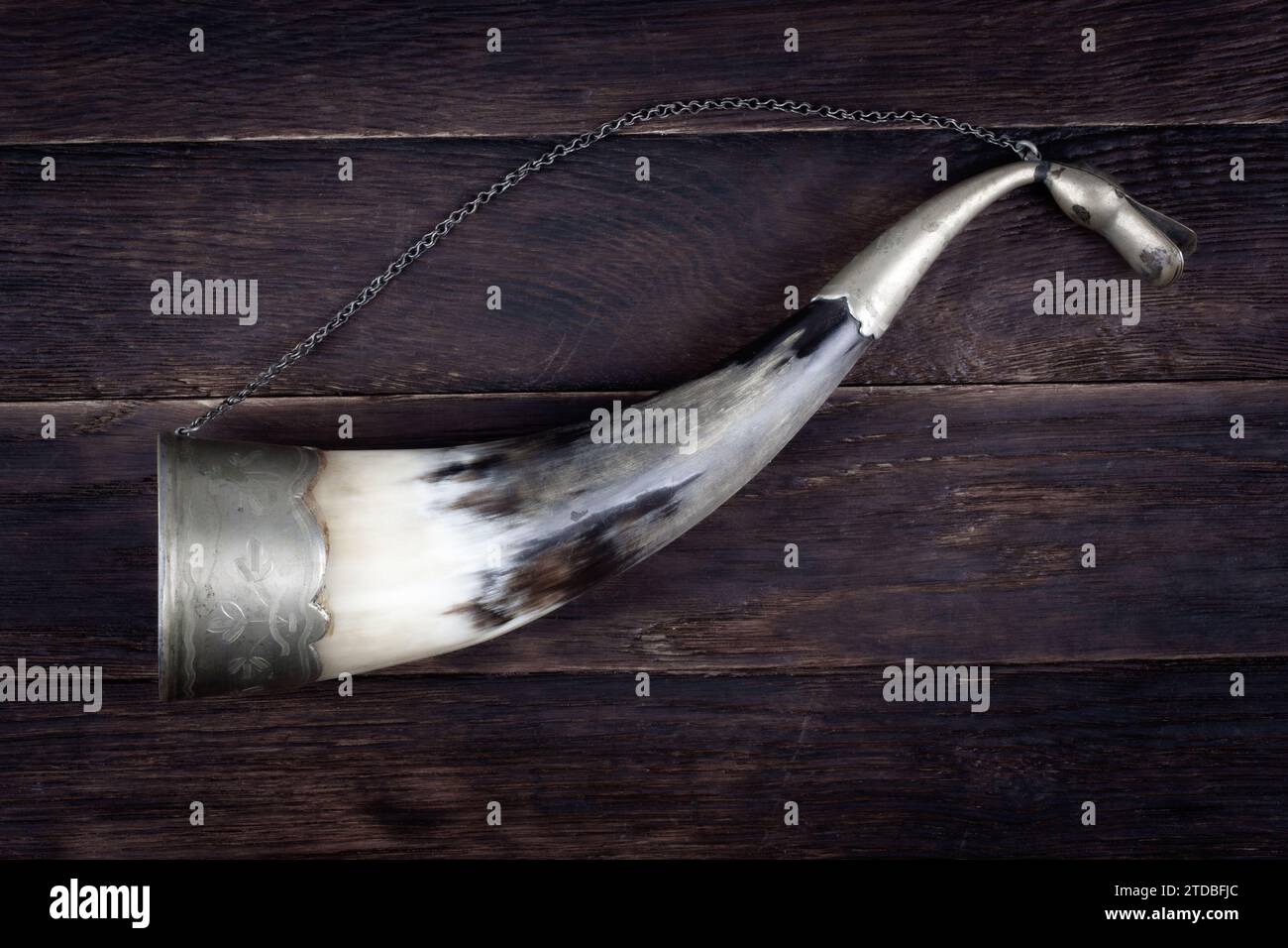 traditional horn for liquor on wooden background Stock Photo - Alamy