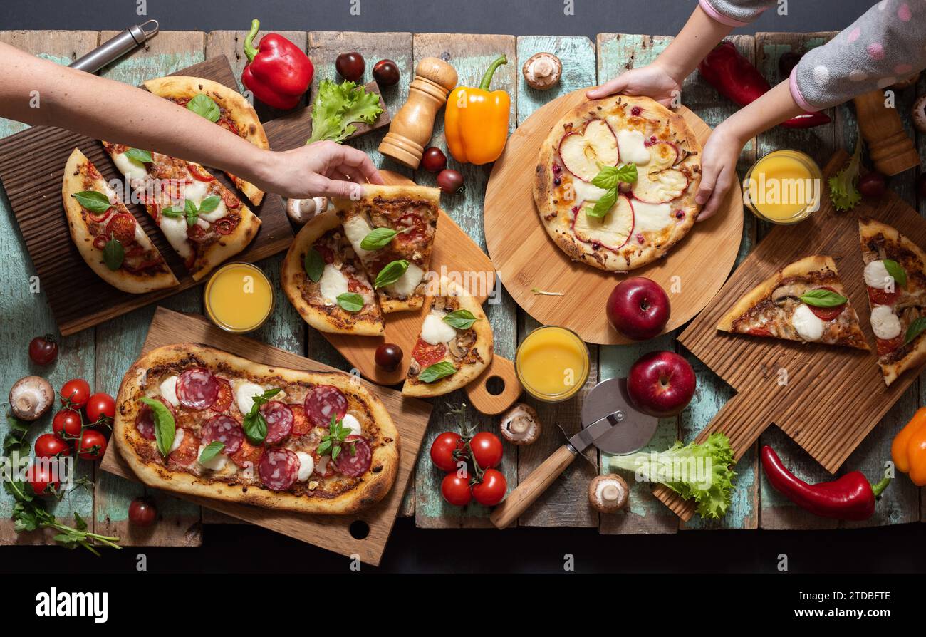 Hand cutting pizza top view hi-res stock photography and images - Alamy