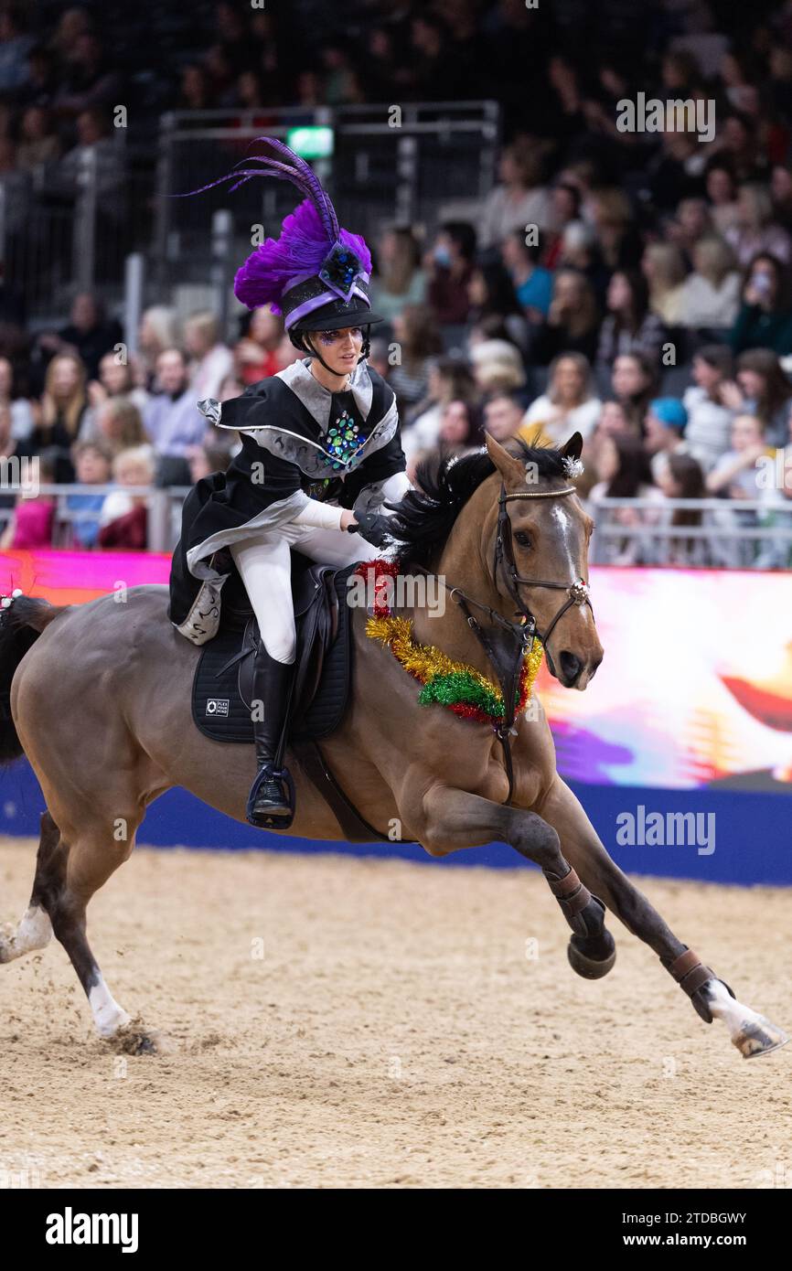 London, UK. December 17, 2023. Tim Gredley and Lily Attwood dressed as ...
