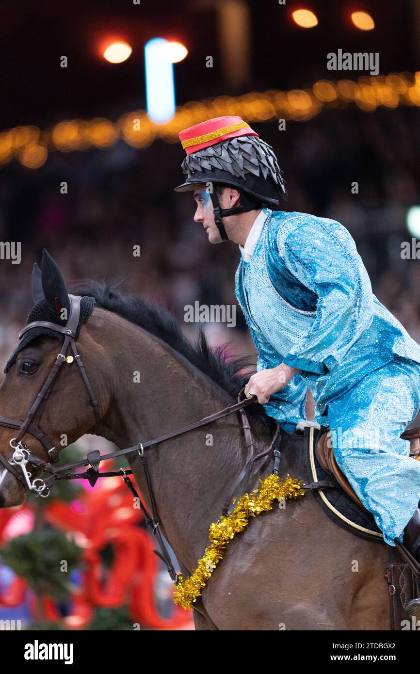 London, UK. December 17, 2023. Tim Gredley and Lily Attwood dressed as ...