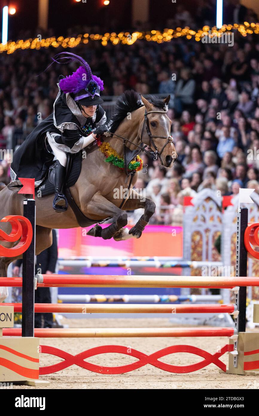 London, UK. December 17, 2023. Tim Gredley and Lily Attwood dressed as ...