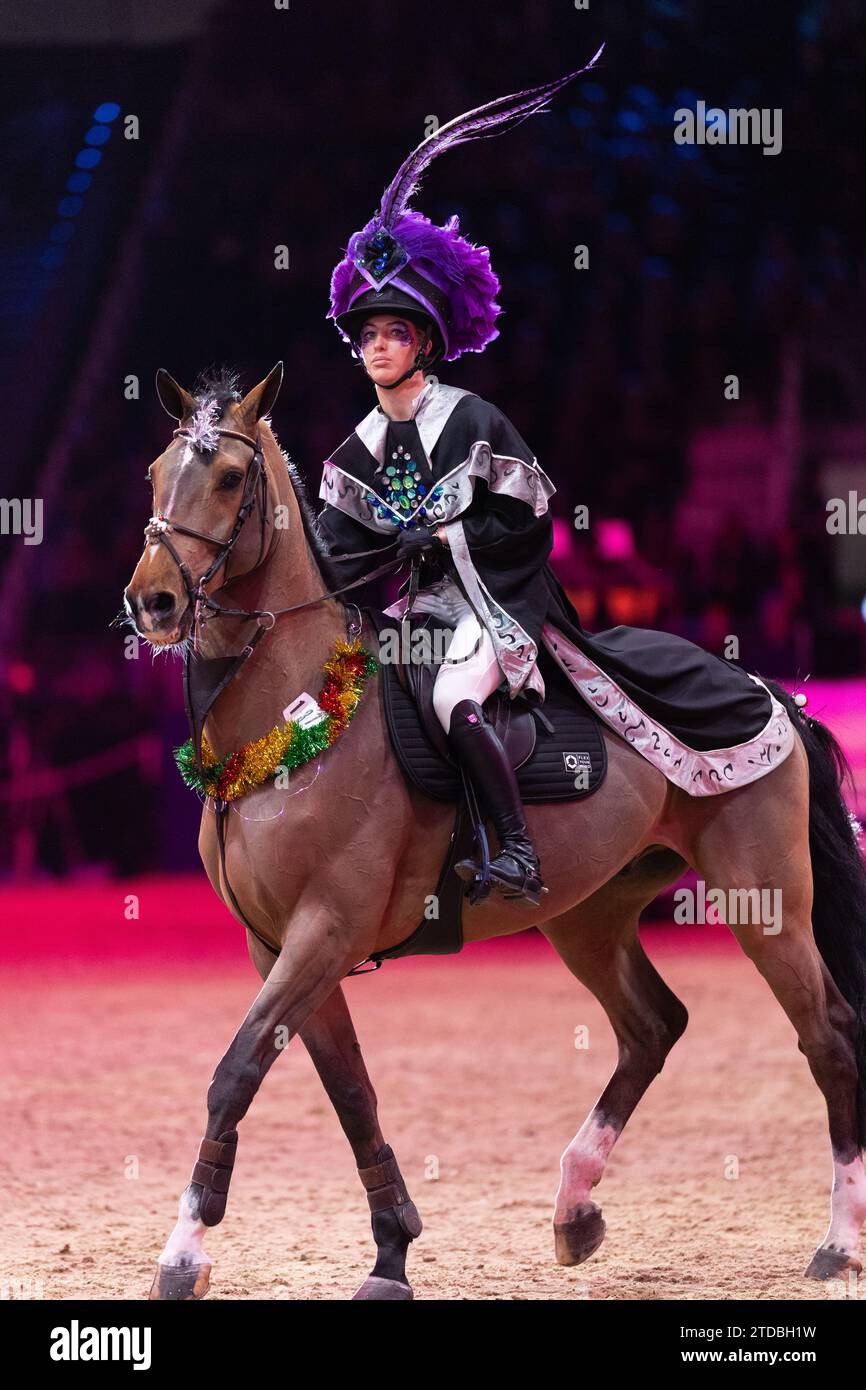 London, UK. December 17, 2023. Tim Gredley and Lily Attwood dressed as ...