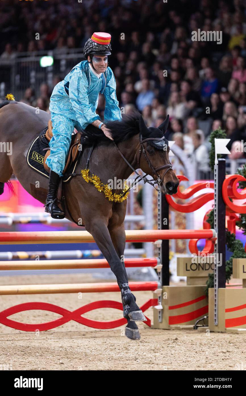 London, UK. December 17, 2023. Tim Gredley and Lily Attwood dressed as ...