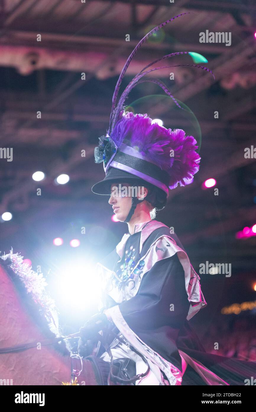 London, UK. December 17, 2023. Tim Gredley and Lily Attwood dressed as ...