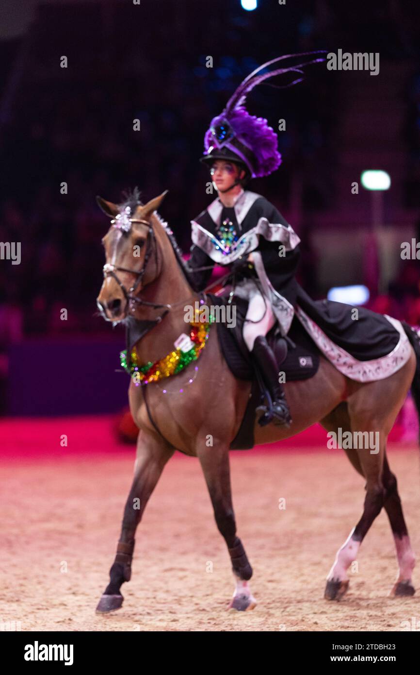 London, UK. December 17, 2023. Tim Gredley and Lily Attwood dressed as ...