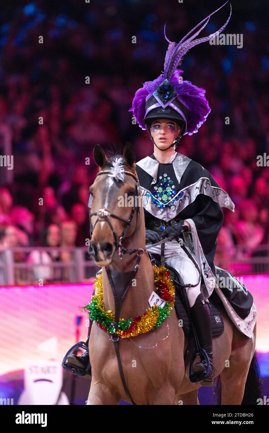 London, UK. December 17, 2023. Tim Gredley and Lily Attwood dressed as ...