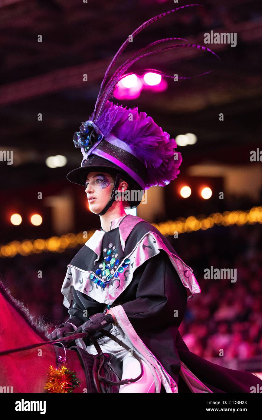 London, UK. December 17, 2023. Tim Gredley and Lily Attwood dressed as ...