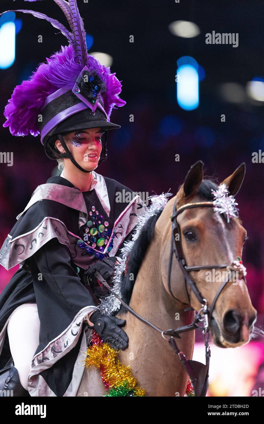 London, UK. December 17, 2023. Tim Gredley and Lily Attwood dressed as ...