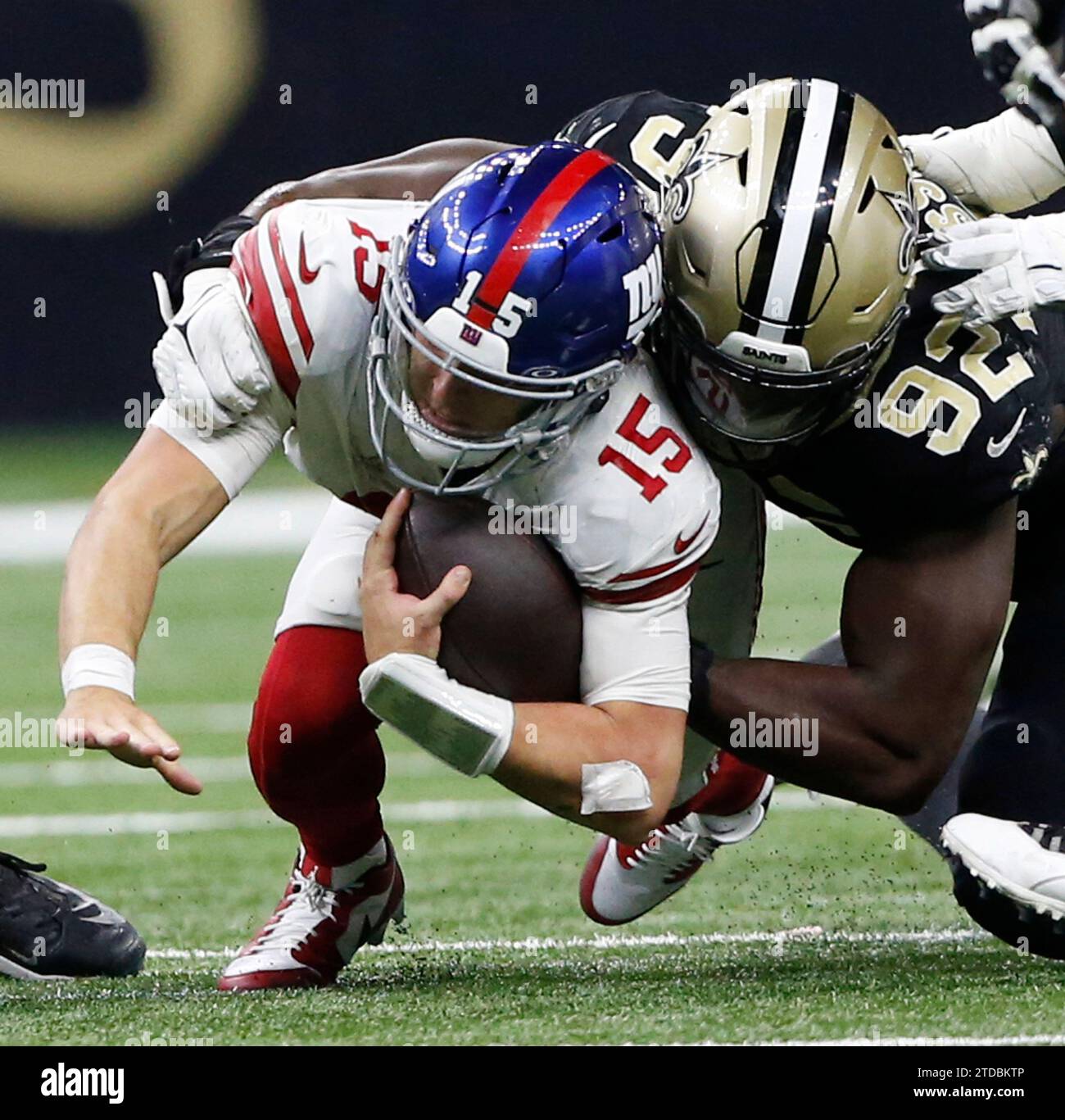 New Orleans Saints defensive end Tanoh Kpassagnon (92) sacks New York Giants quarterback Tommy ...