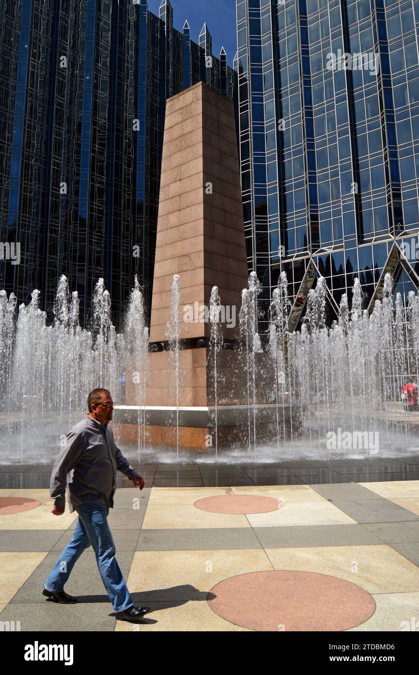 An adult man walks through the public space of PPG Place during ...